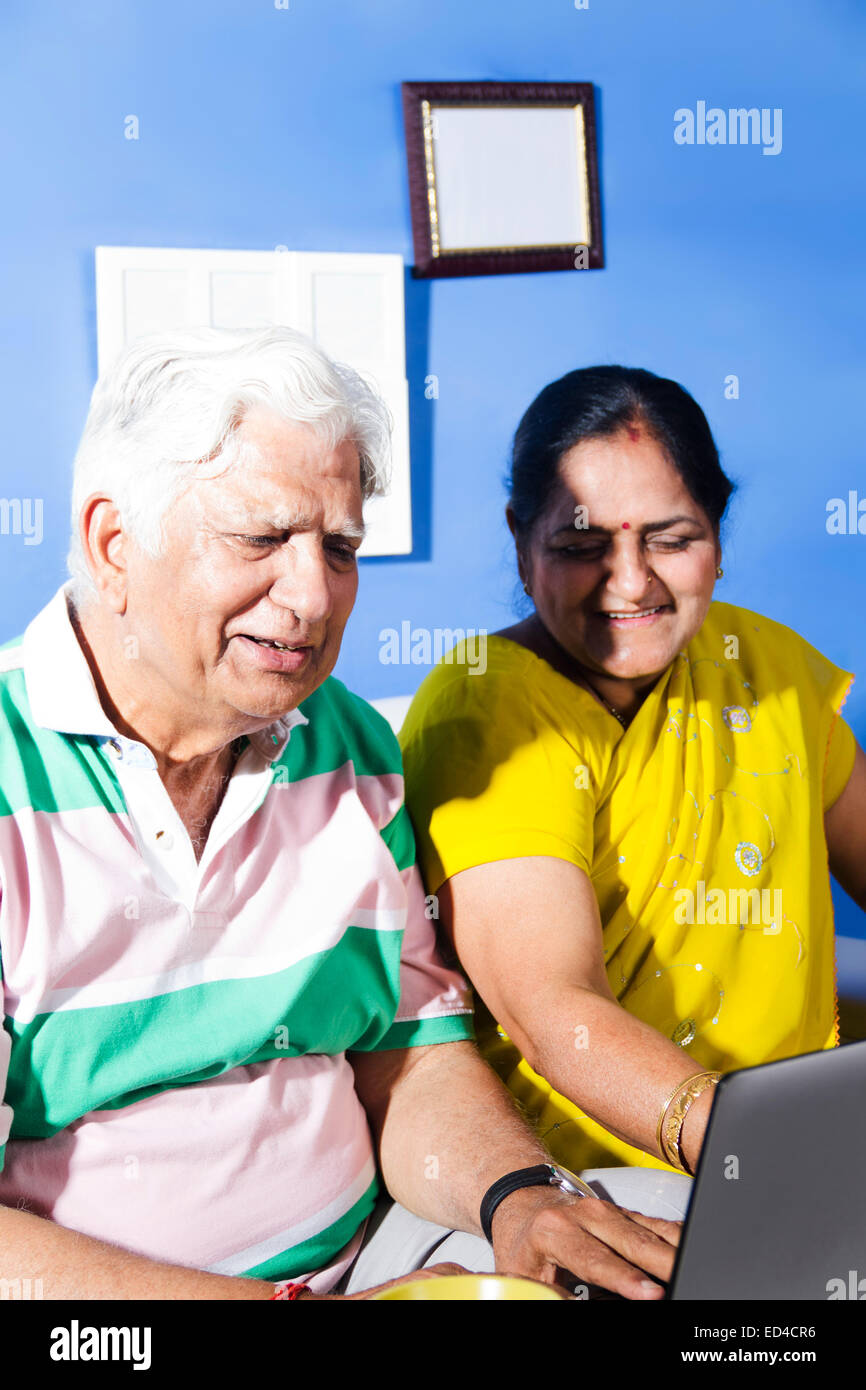 2 old indian married couple home laptop working Stock Photo - Alamy