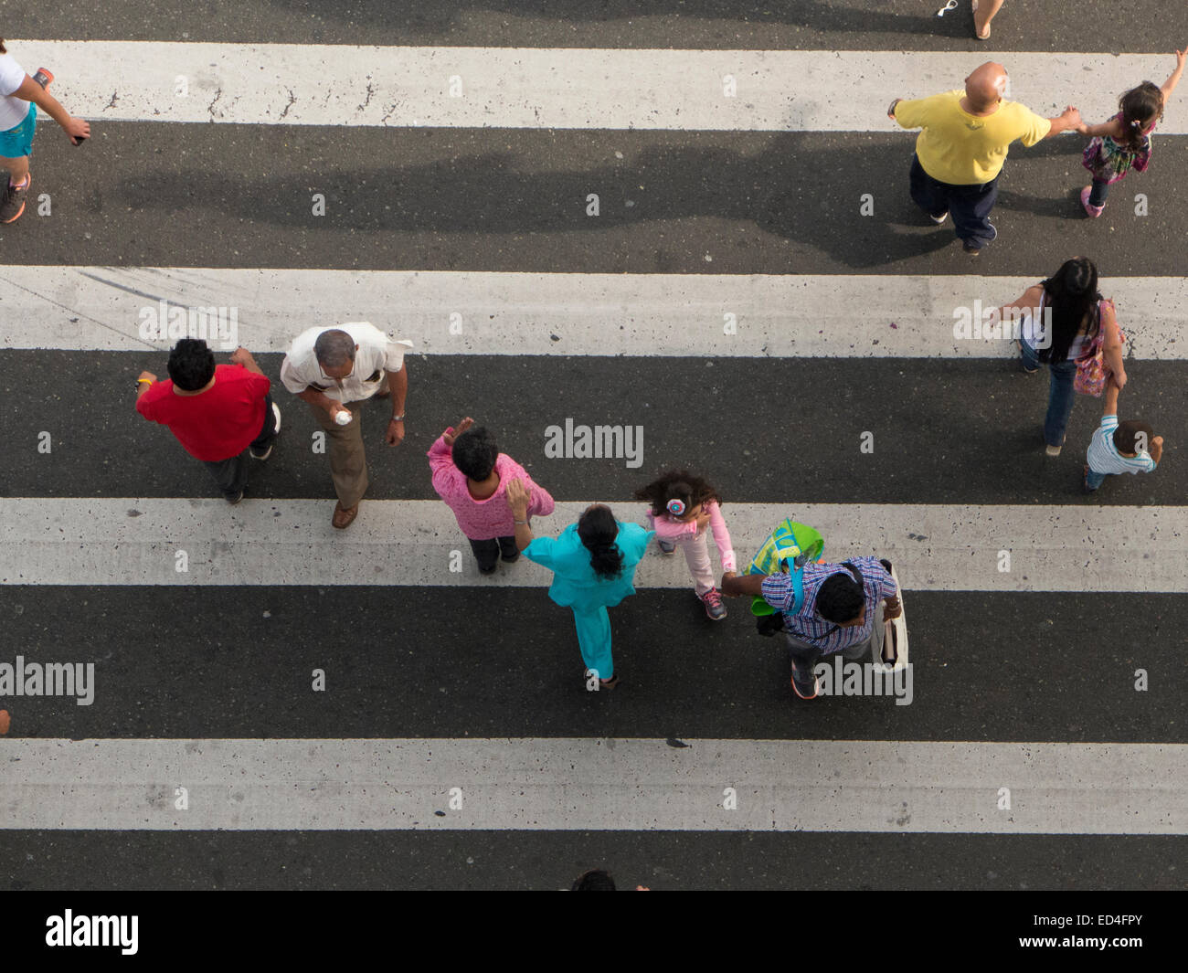 Women men and children walking through a zebra crossing top view Stock ...