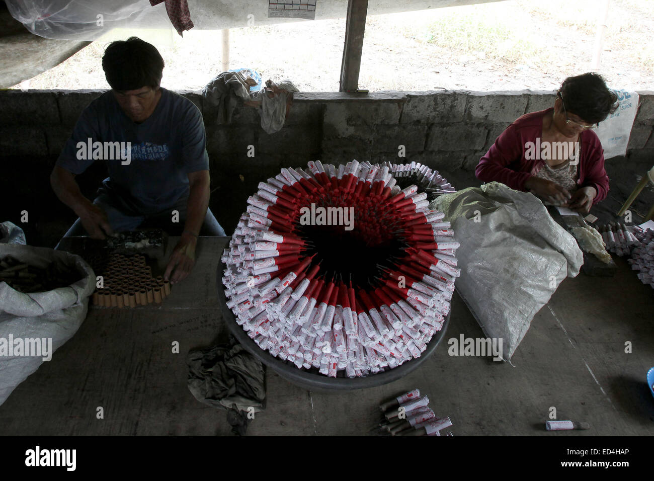 Bulacan, Philippines. 27th Dec, 2014. Workers prepare fireworks at a ...