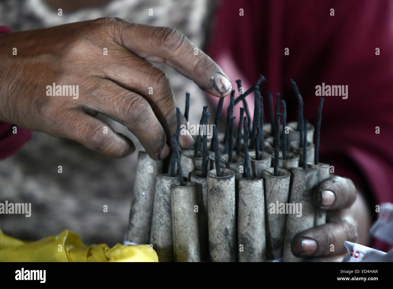 Bulacan, Philippines. 27th Dec, 2014. A worker prepares fireworks at a ...