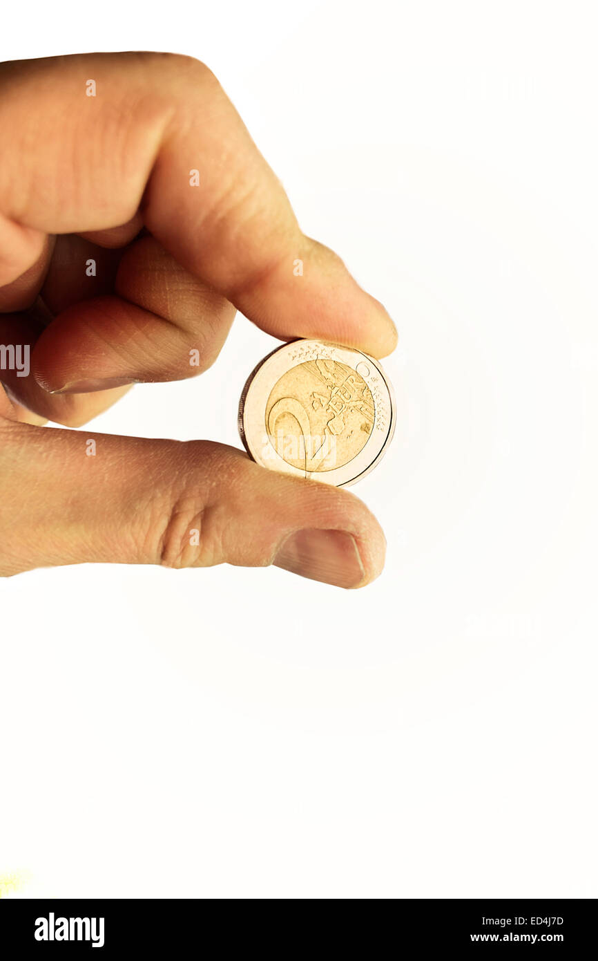 Coin in the Fingers Stock Photo - Alamy