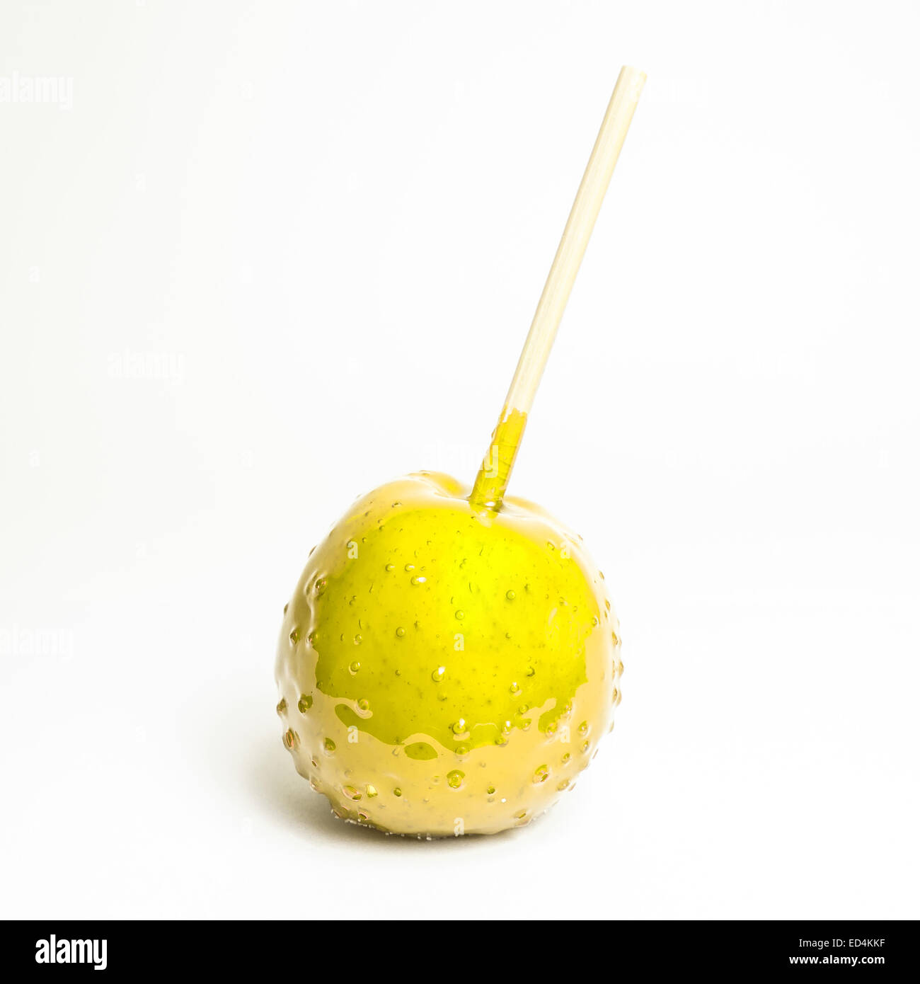 toffee apple yellow on white background (isolated Stock Photo - Alamy