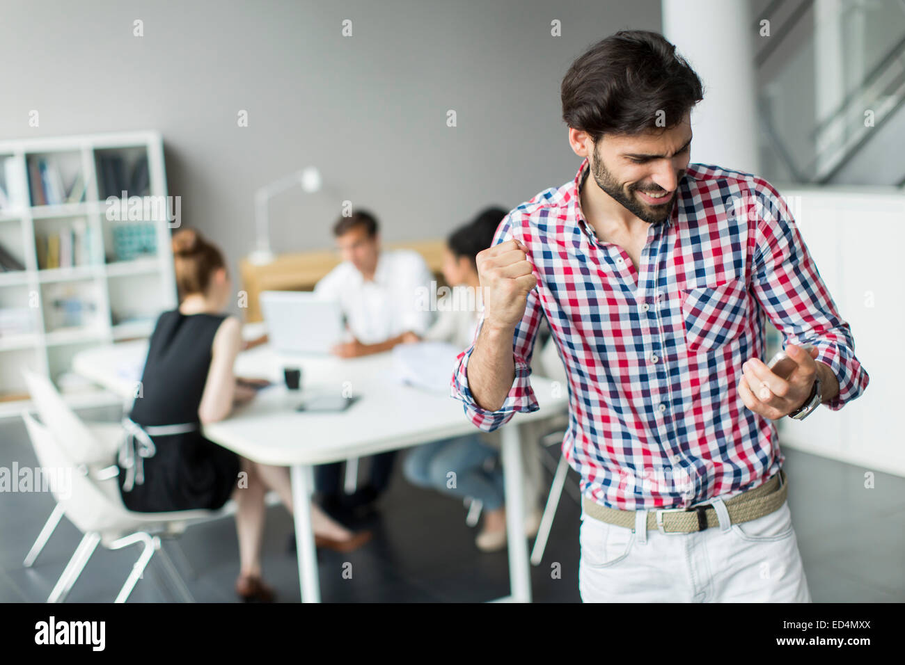 Young man in the office Stock Photo - Alamy