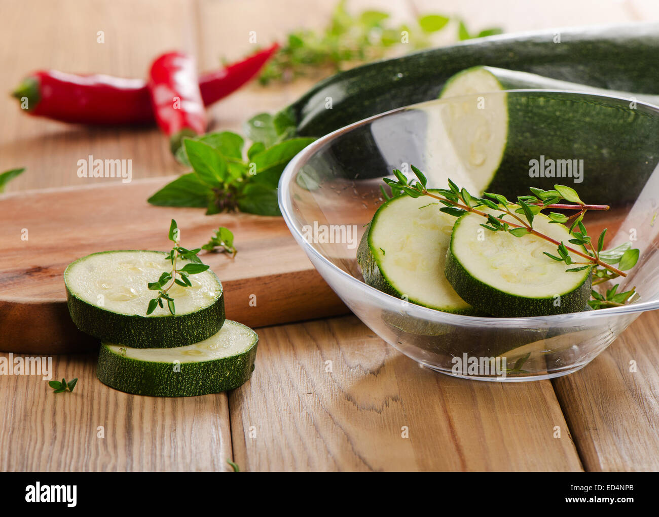 Fresh zucchini on a wooden cutting board. Selective focus Stock Photo ...
