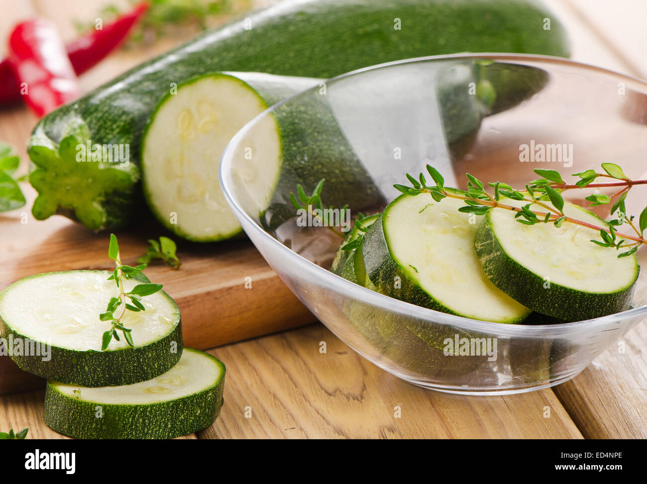 Fresh zucchini on a wooden cutting board. Selective focus Stock Photo ...