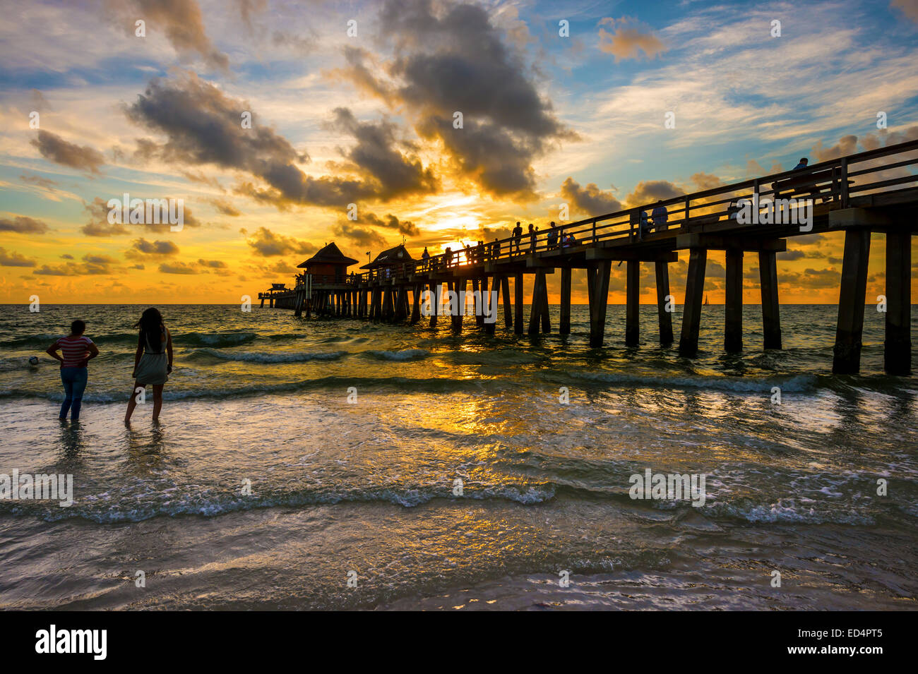 waves pier naples florida usa sunset ocean sea Stock Photo - Alamy