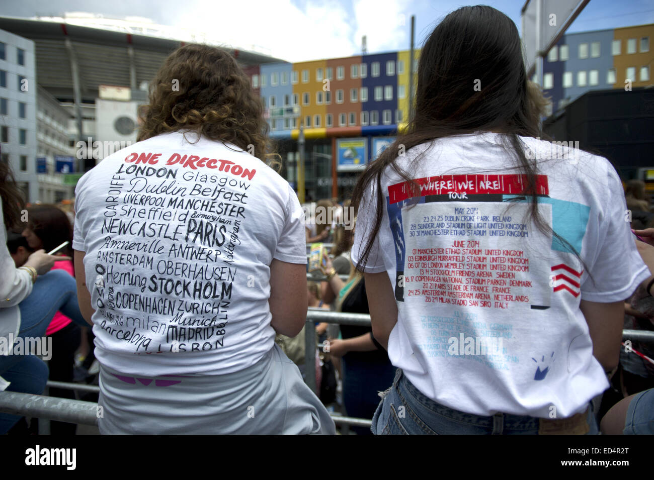 Fans of boyband One Direction gather in large numbers and show their ...