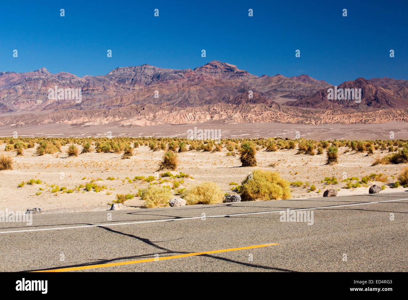 The road through Death Valley which is the lowest, hottest, driest ...