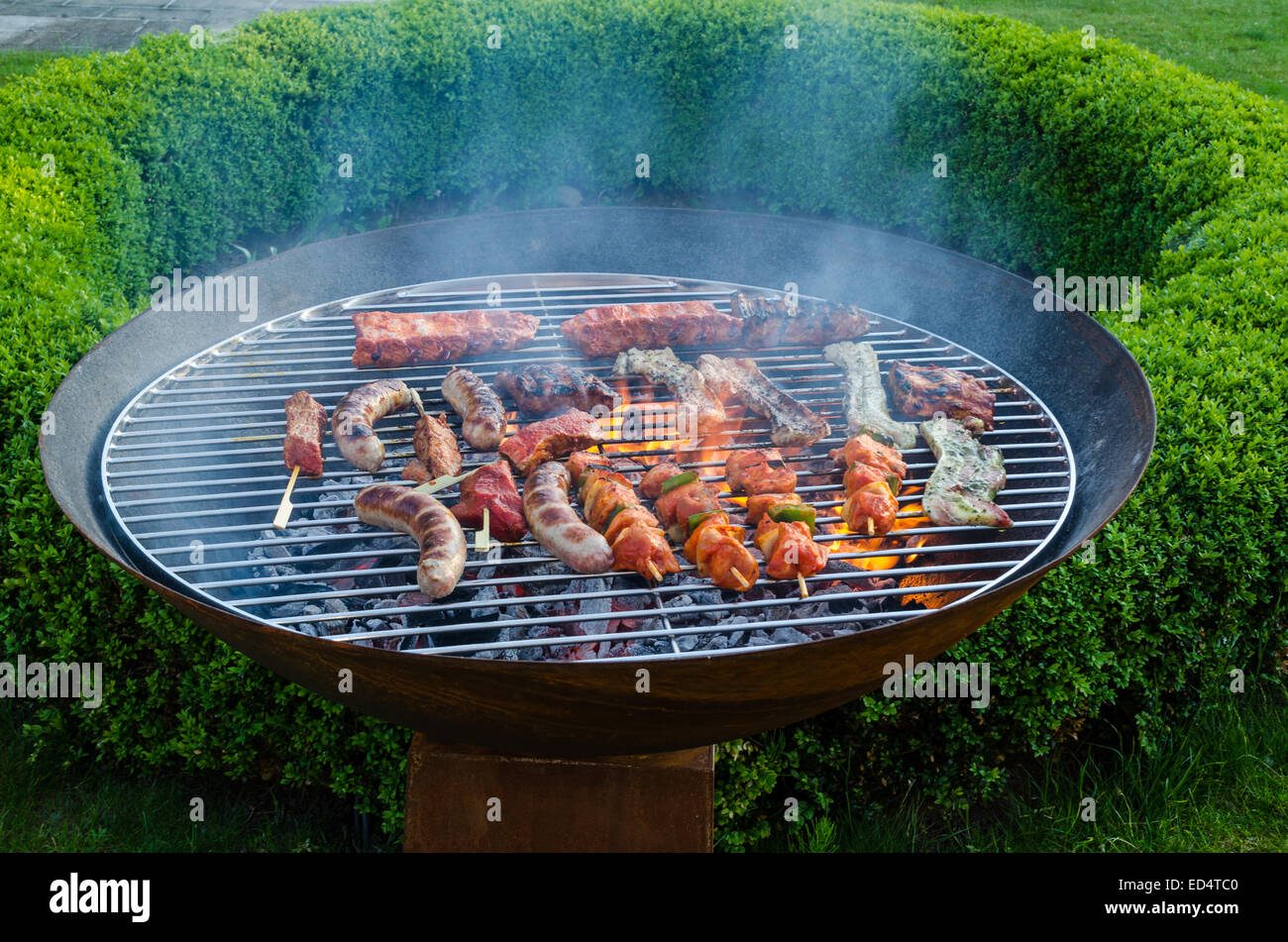 Big barbecue grill featuring various kinds of meat Stock Photo - Alamy