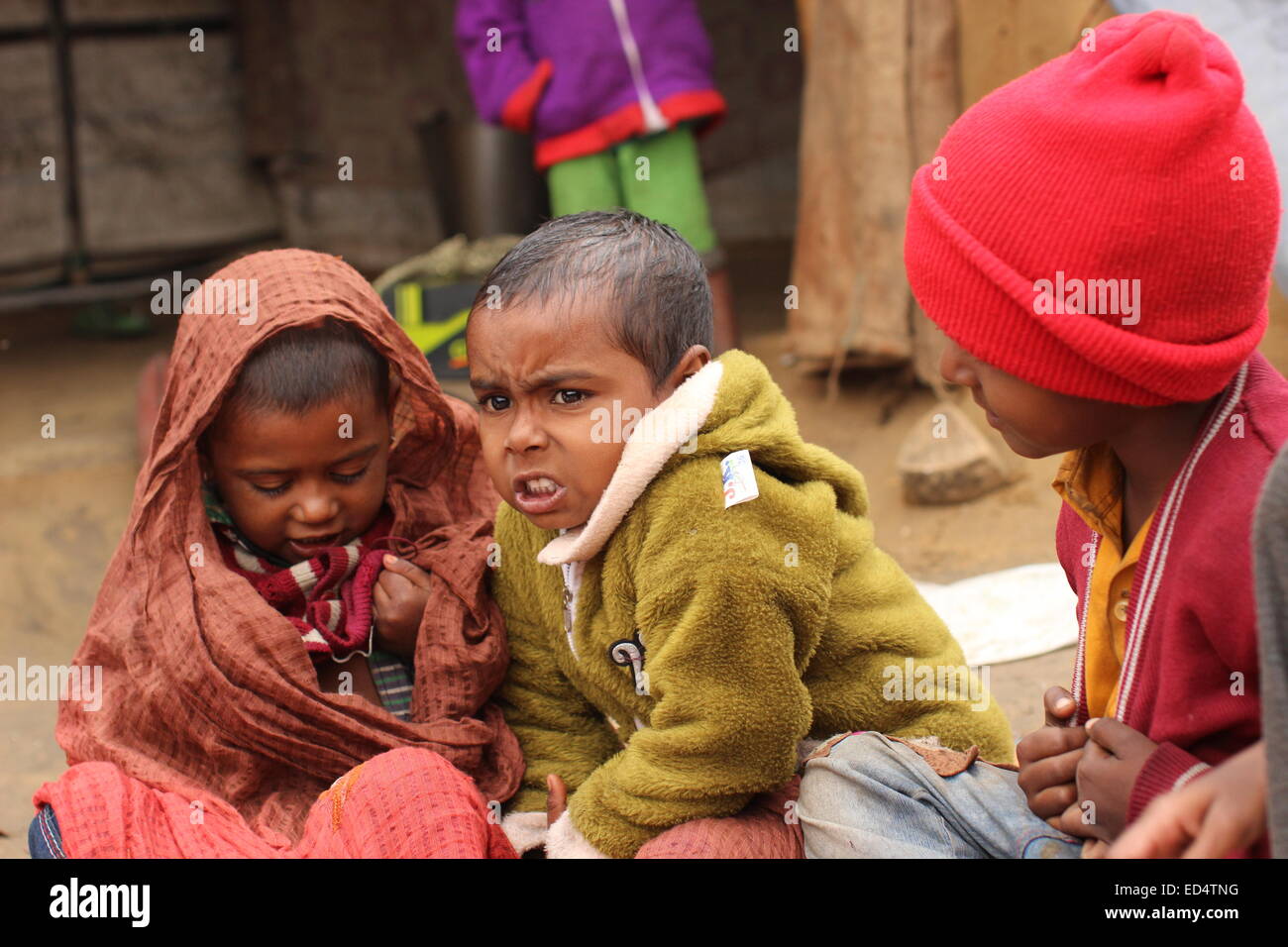 Agra, India. 14th Dec, 2014. CHildren sit in the Kabadi-Slum in Agra ...