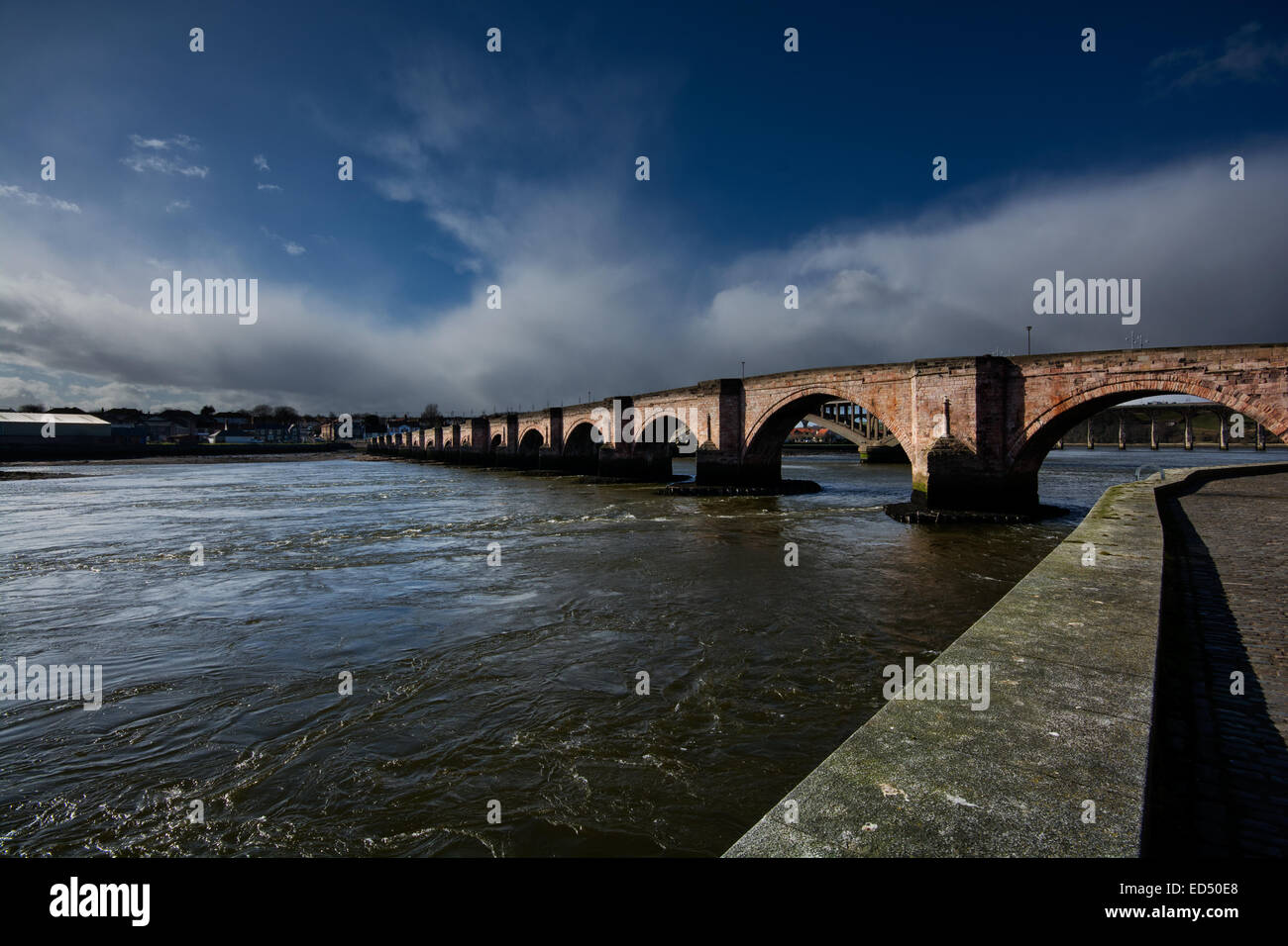 Berwick Bridge, also known as the Old Bridge, spans the River Tweed in ...