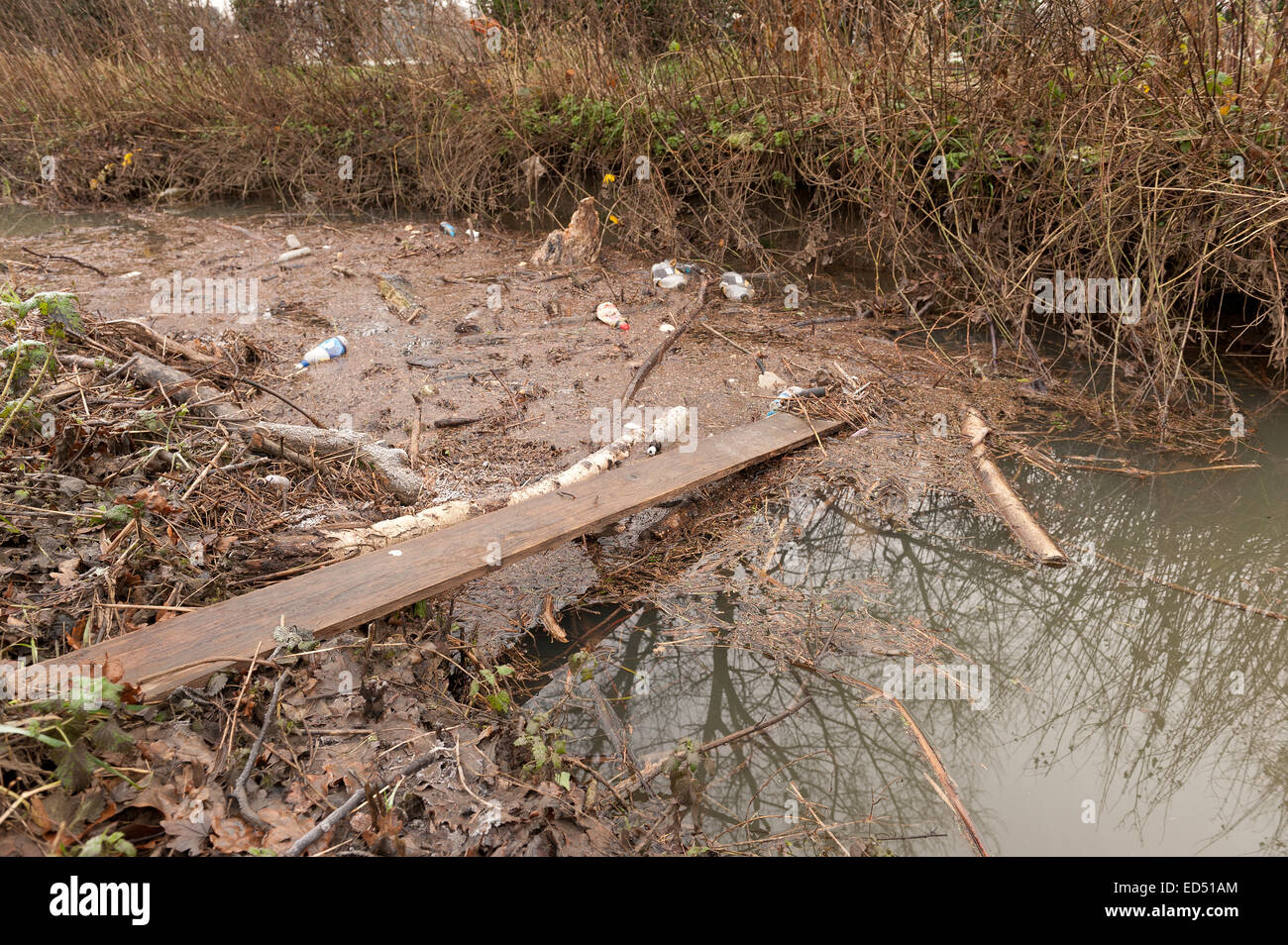 Making use of discarded scaffold plank board attempts are made to cross ...