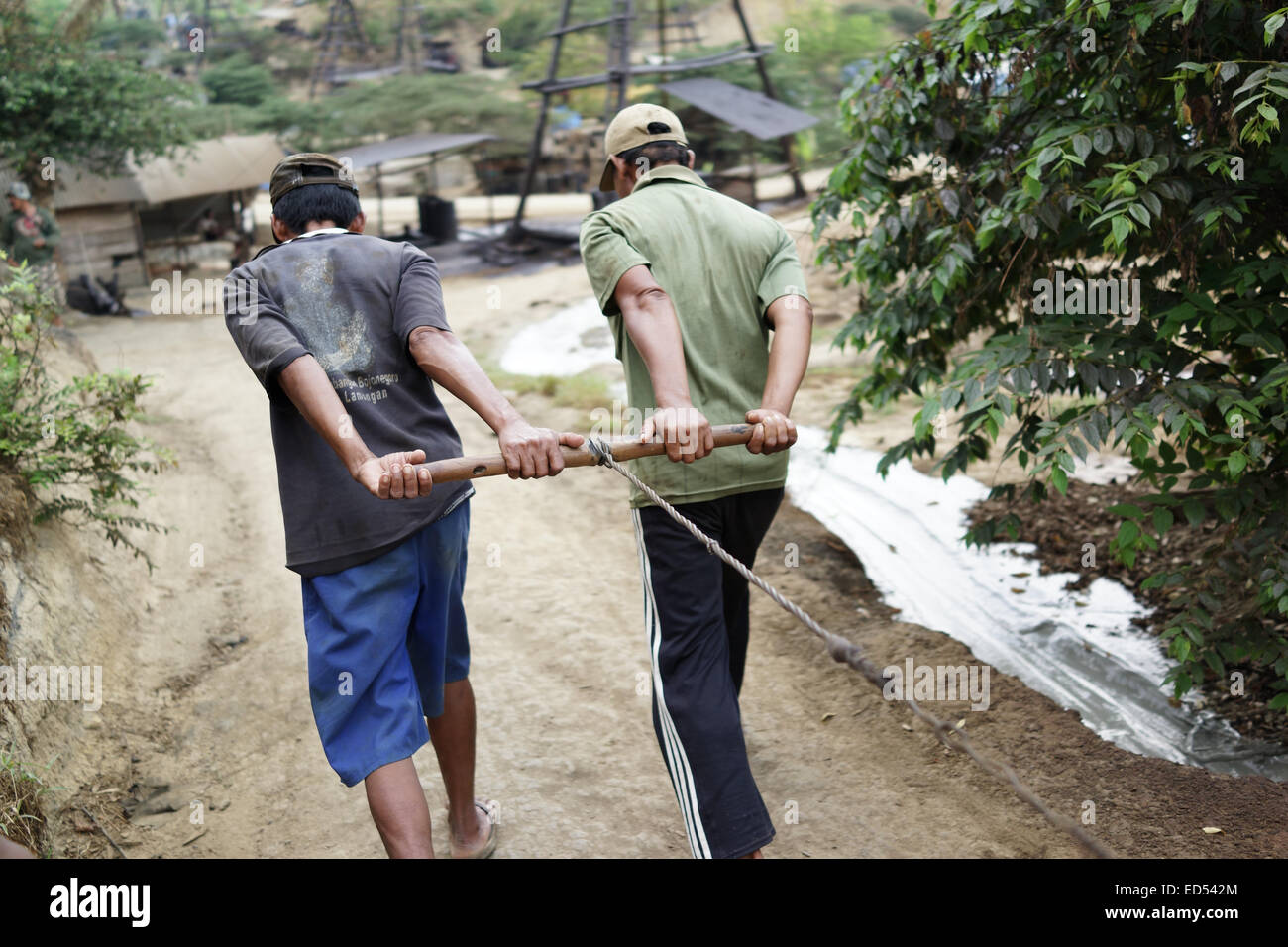 The miners pull mine to lift crude oil from the wells manually in the ...