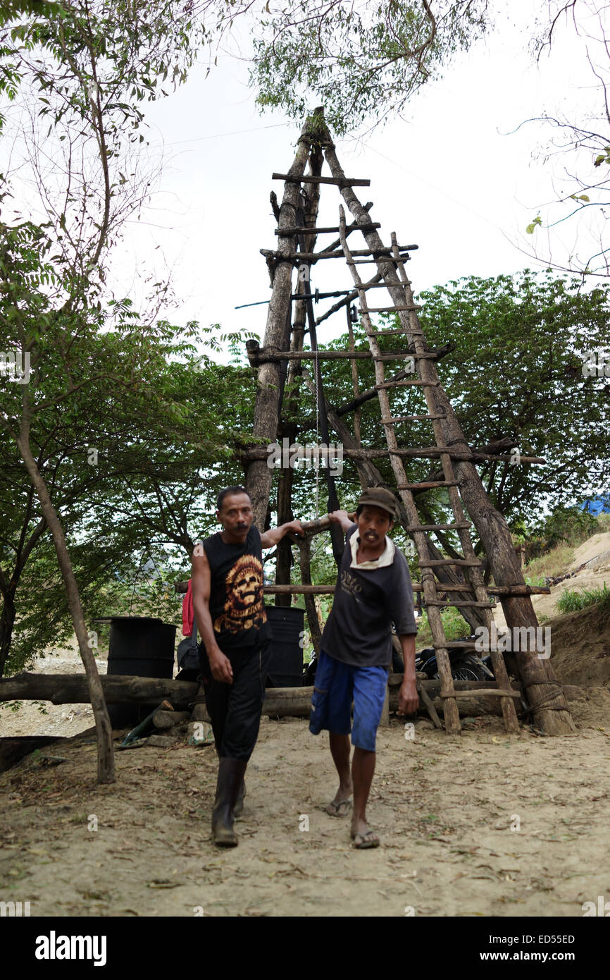 The miners pull mine to lift crude oil from the wells manually in the ...