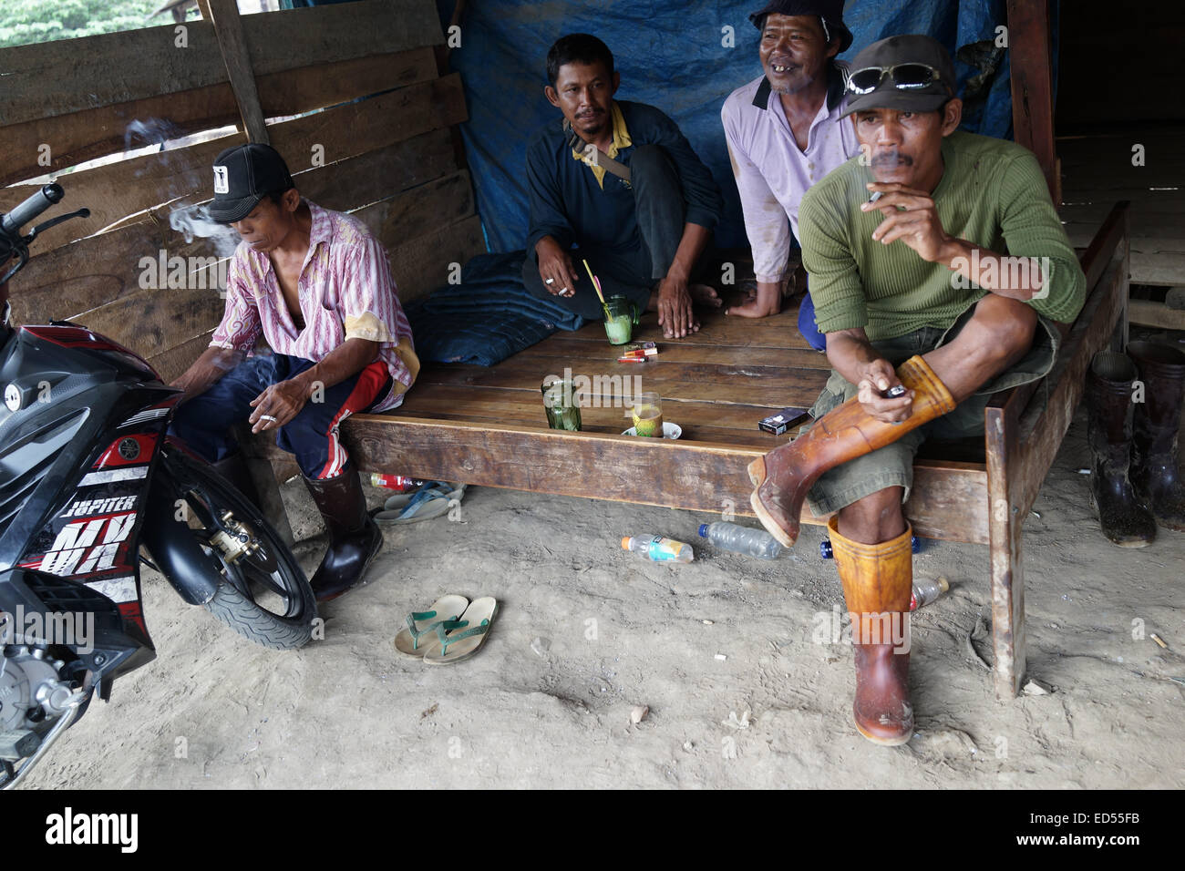 A number of workers to rest after working in traditional oil fields in ...