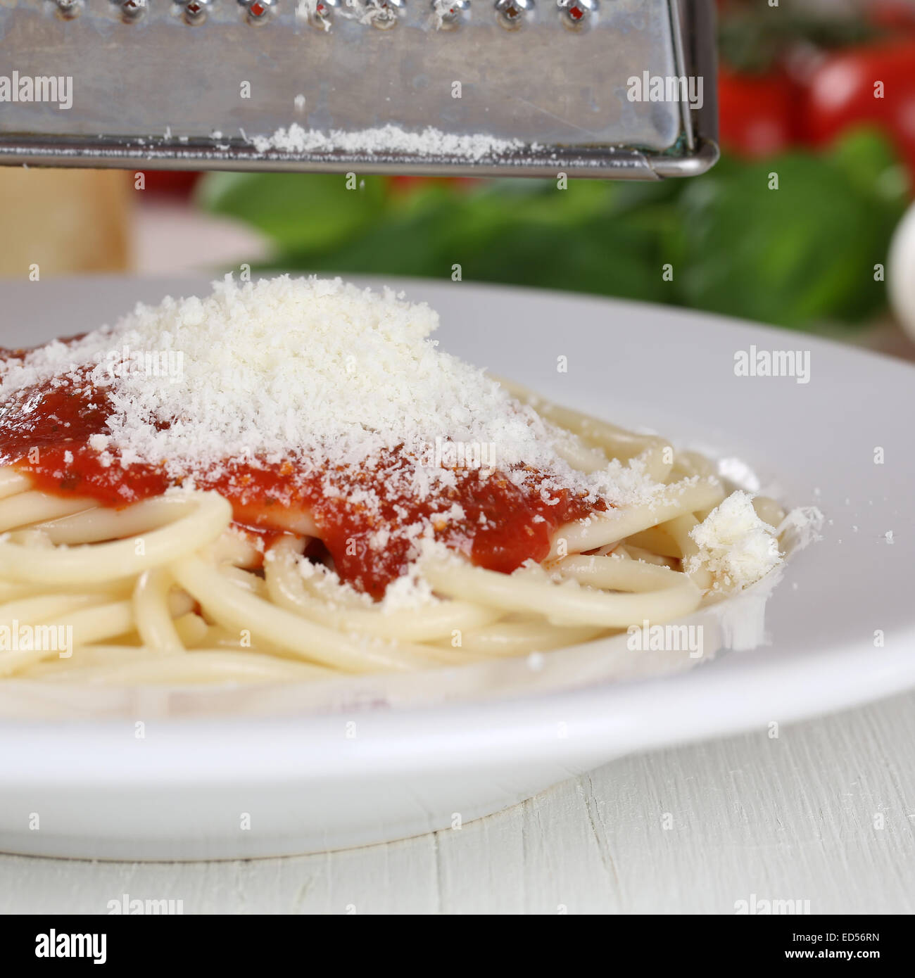 Cooking spaghetti noodles pasta food grating Parmesan cheese on plate ...