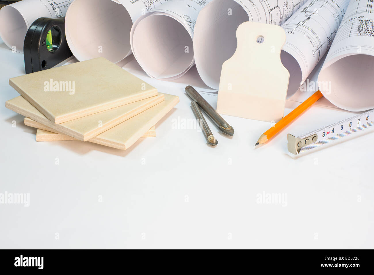 Drawing rolls, construction tools and materials composition Stock Photo ...