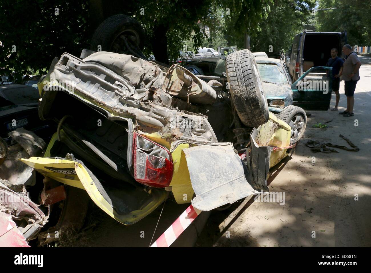 People and rescue workers try to salvage what they can from the ...