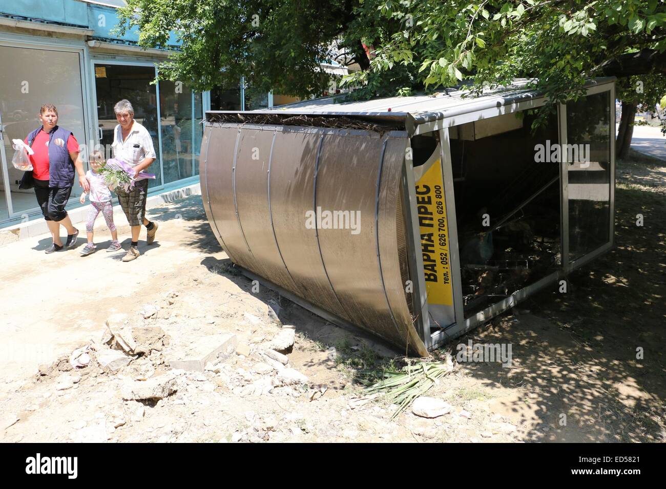 People and rescue workers try to salvage what they can from the ...