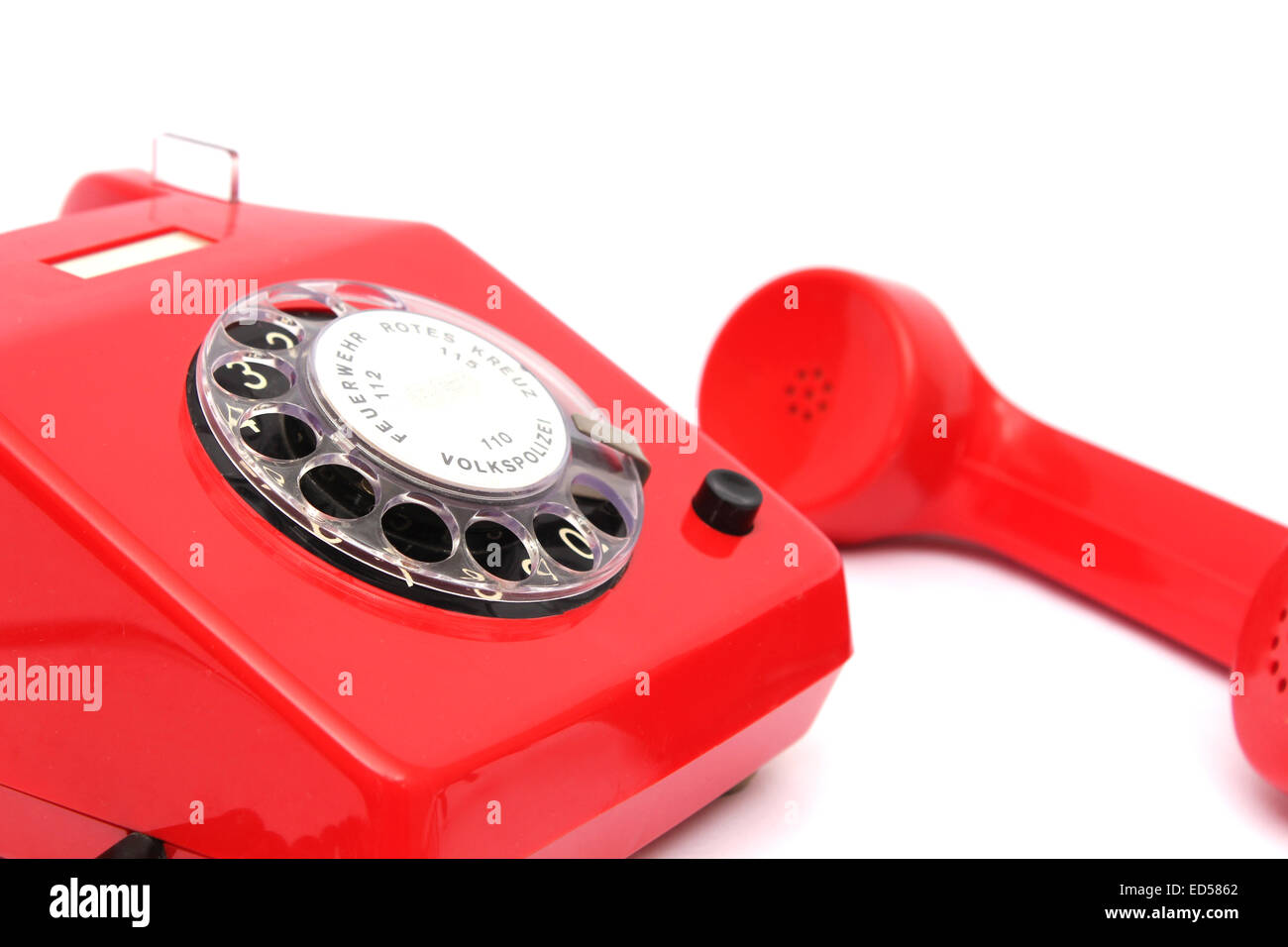 red plastic phone with rotary dial Stock Photo - Alamy