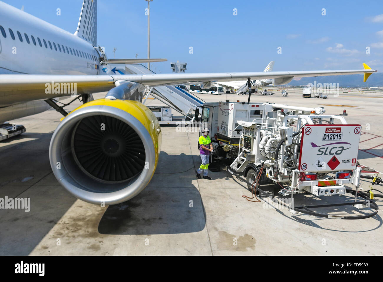 Airbus A320 of the Vueling Airlines receiving fuel from tanker truck at ...