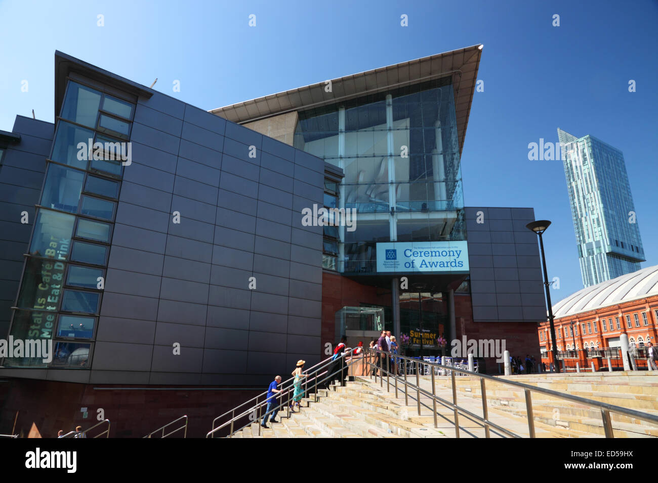 A modern concert hall building with a modern tower block behind Stock ...