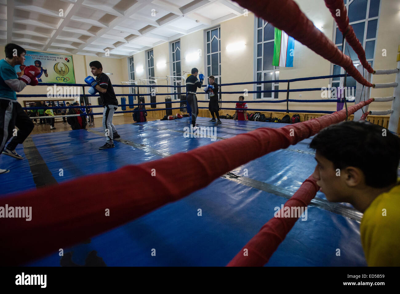 Students of High school of sport art in boxing train on the boxing ring ...