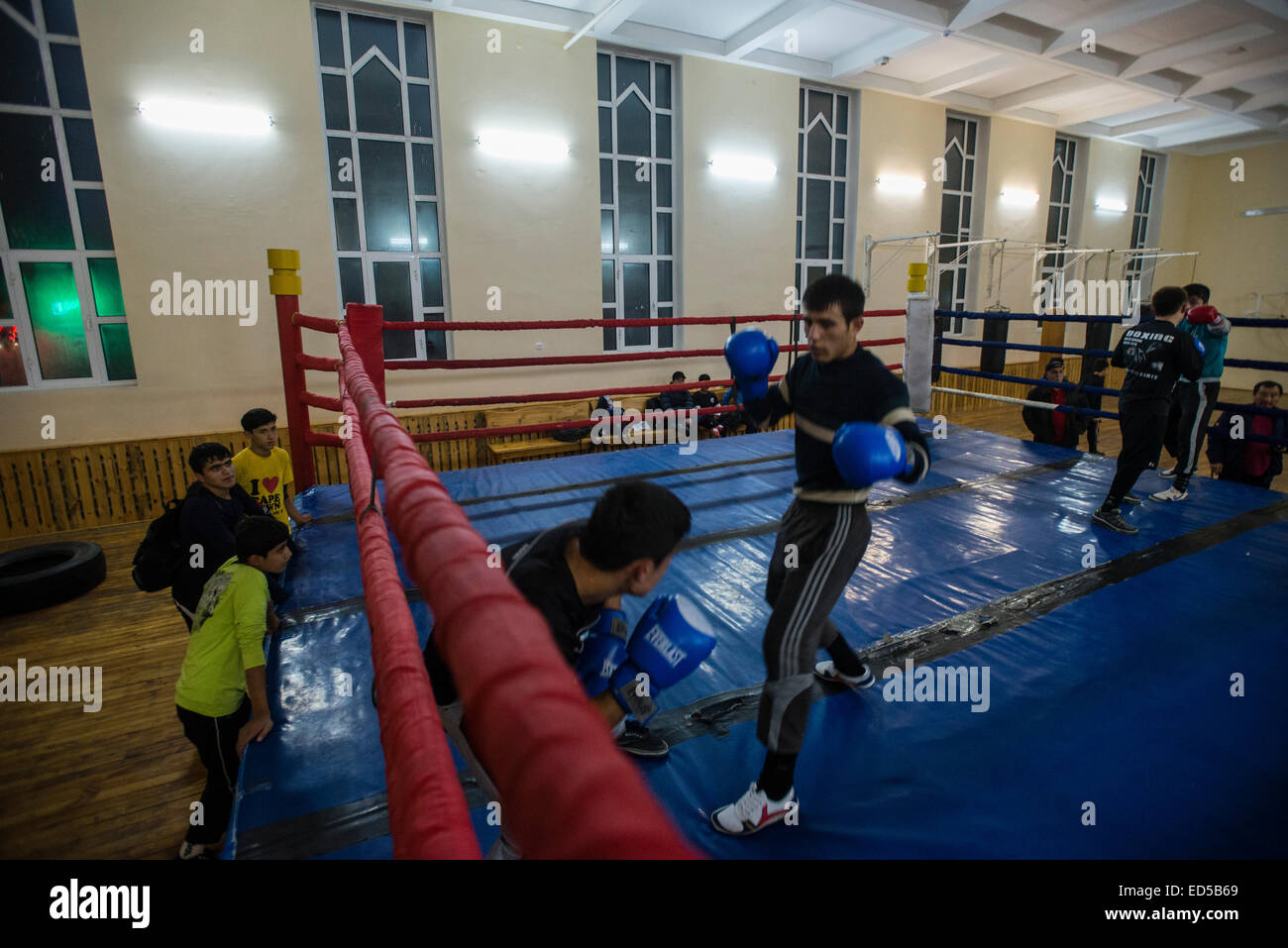 Students of High school of sport art in boxing train on the boxing ring ...