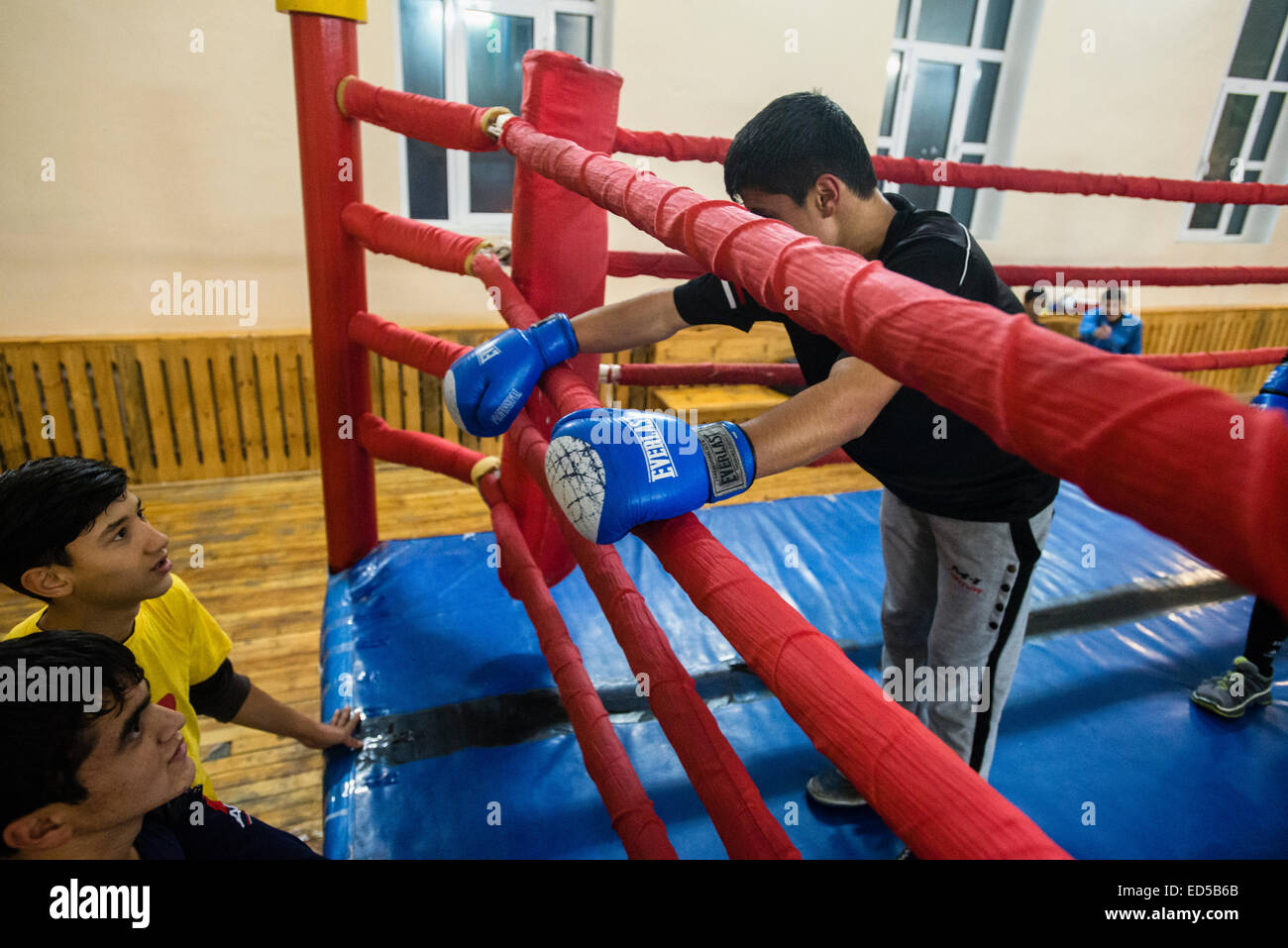 Students of High school of sport art in boxing train on the boxing ring ...