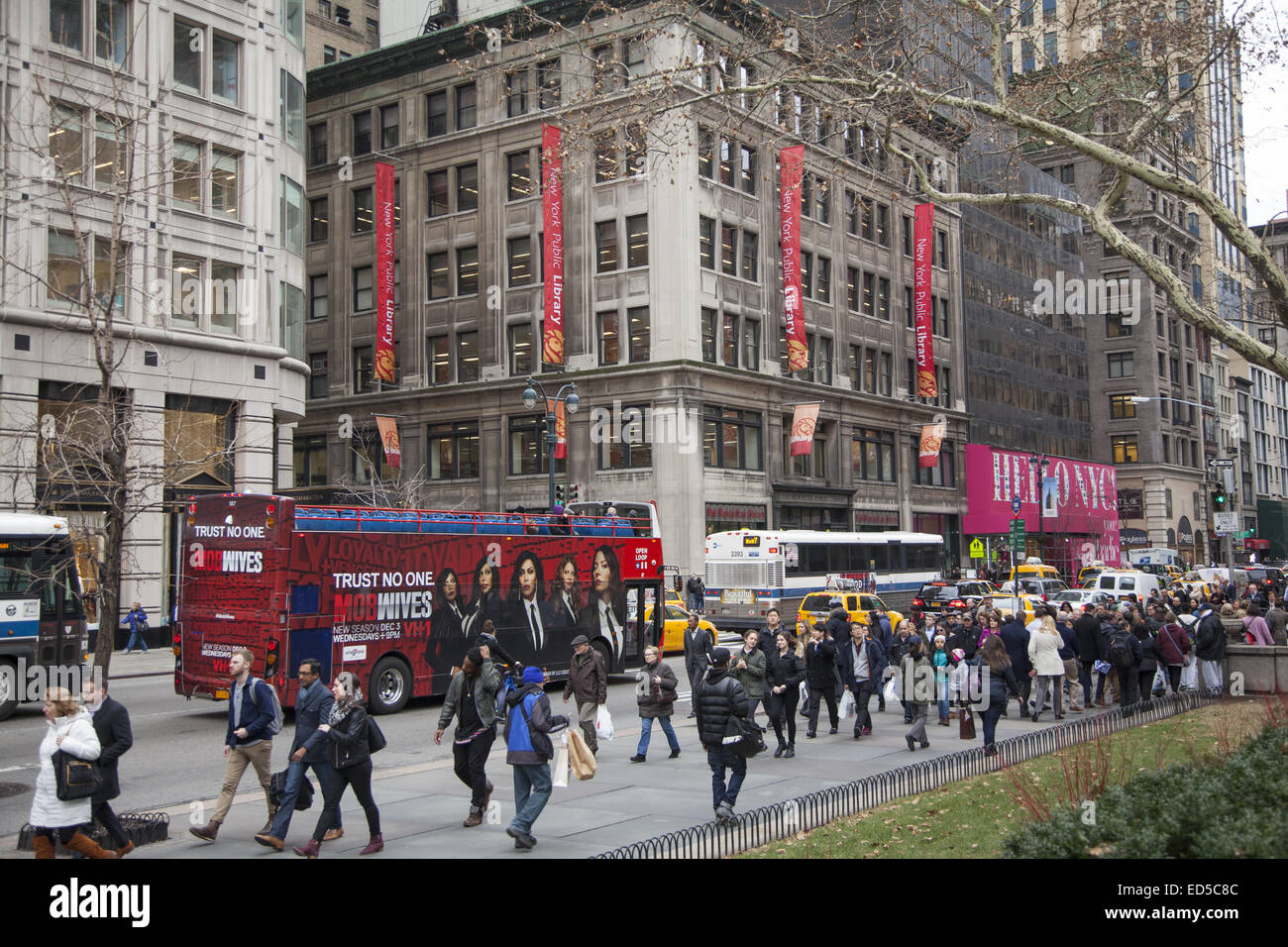 People walk on 5th Avenue near 42nd St.by the New York Public Library ...