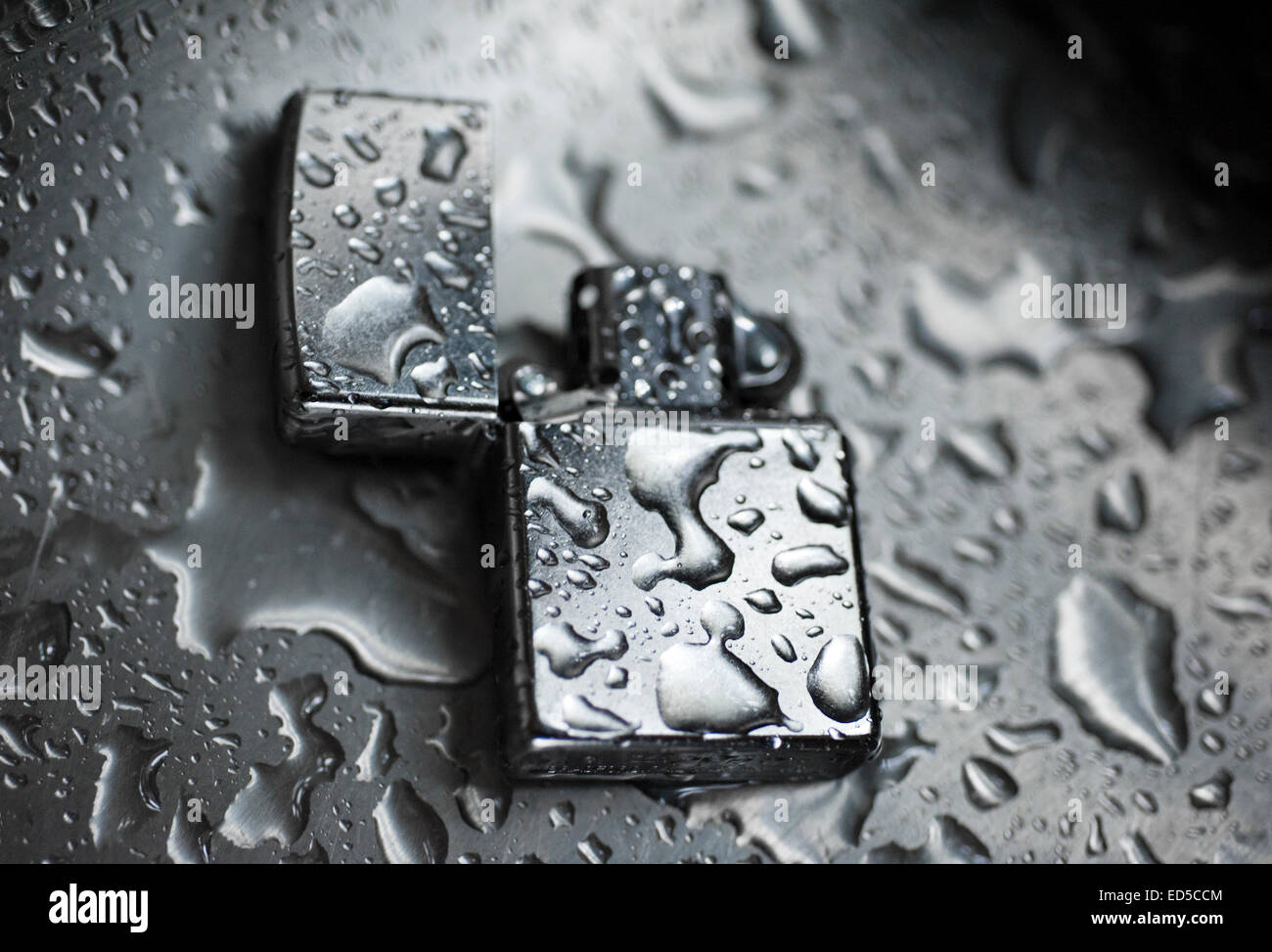 Zippo Lighter in the Rain, Still Life with lighter and water droplets ...