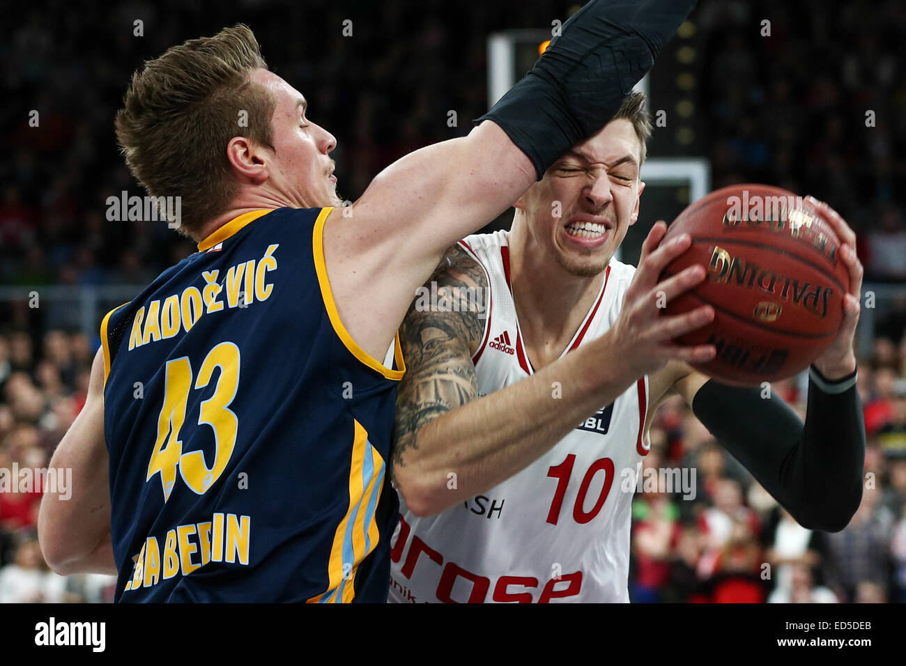 Bamberg, Germany. 26th Dec, 2014. Berlin's Leon Radosevic (L) vies for ...