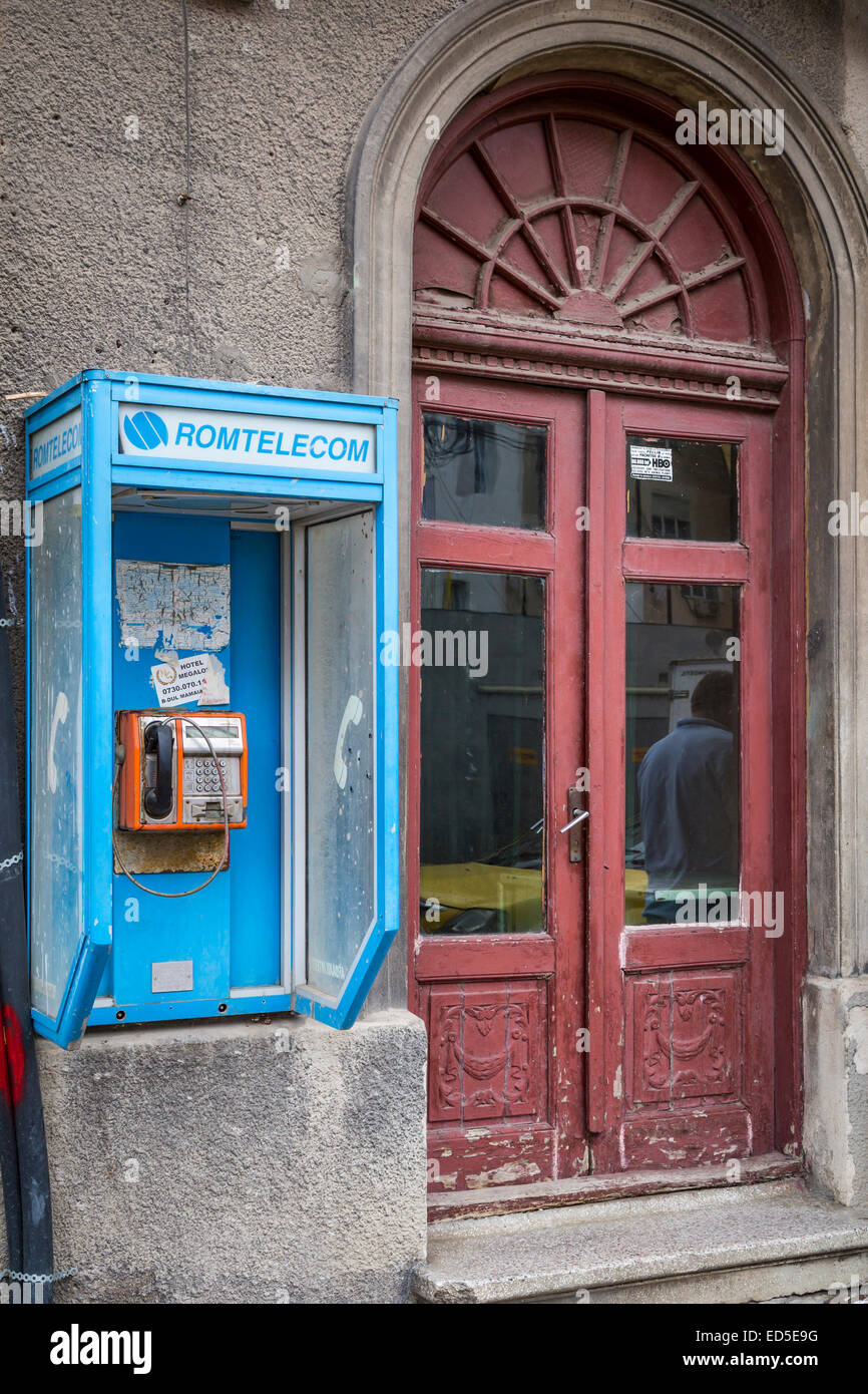 A rustic door and telephone booth in Constanta, Romania, Europe Stock ...