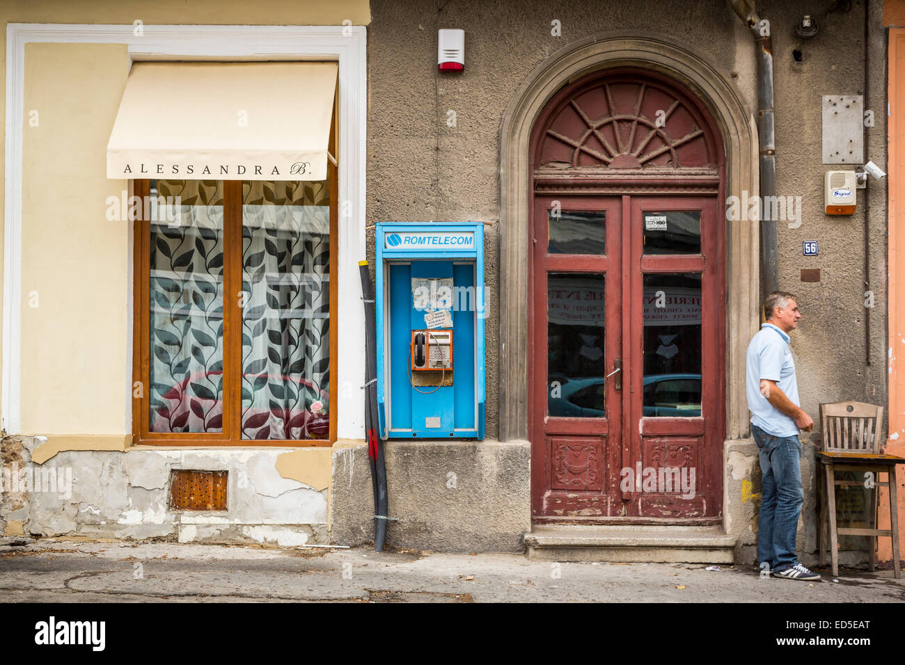 A rustic door and telephone booth in Constanta, Romania, Europe Stock ...