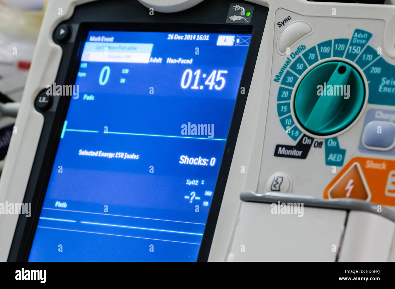 Defibrillator sitting ready for use on a hospital Crash Trolley Stock ...