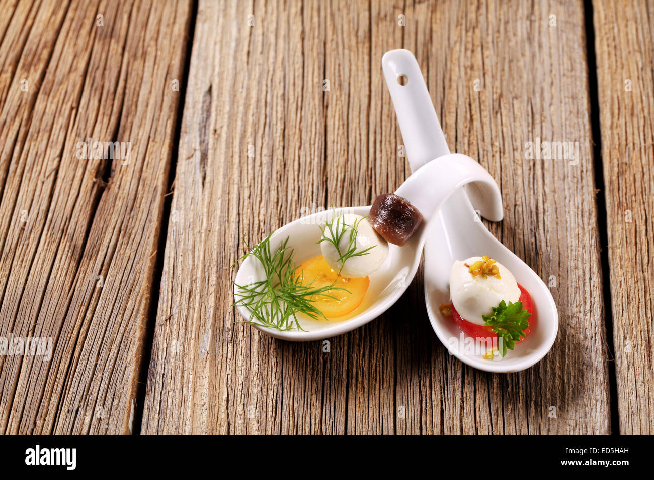 Mozzarella cheese snacks on porcelain spoons Stock Photo - Alamy