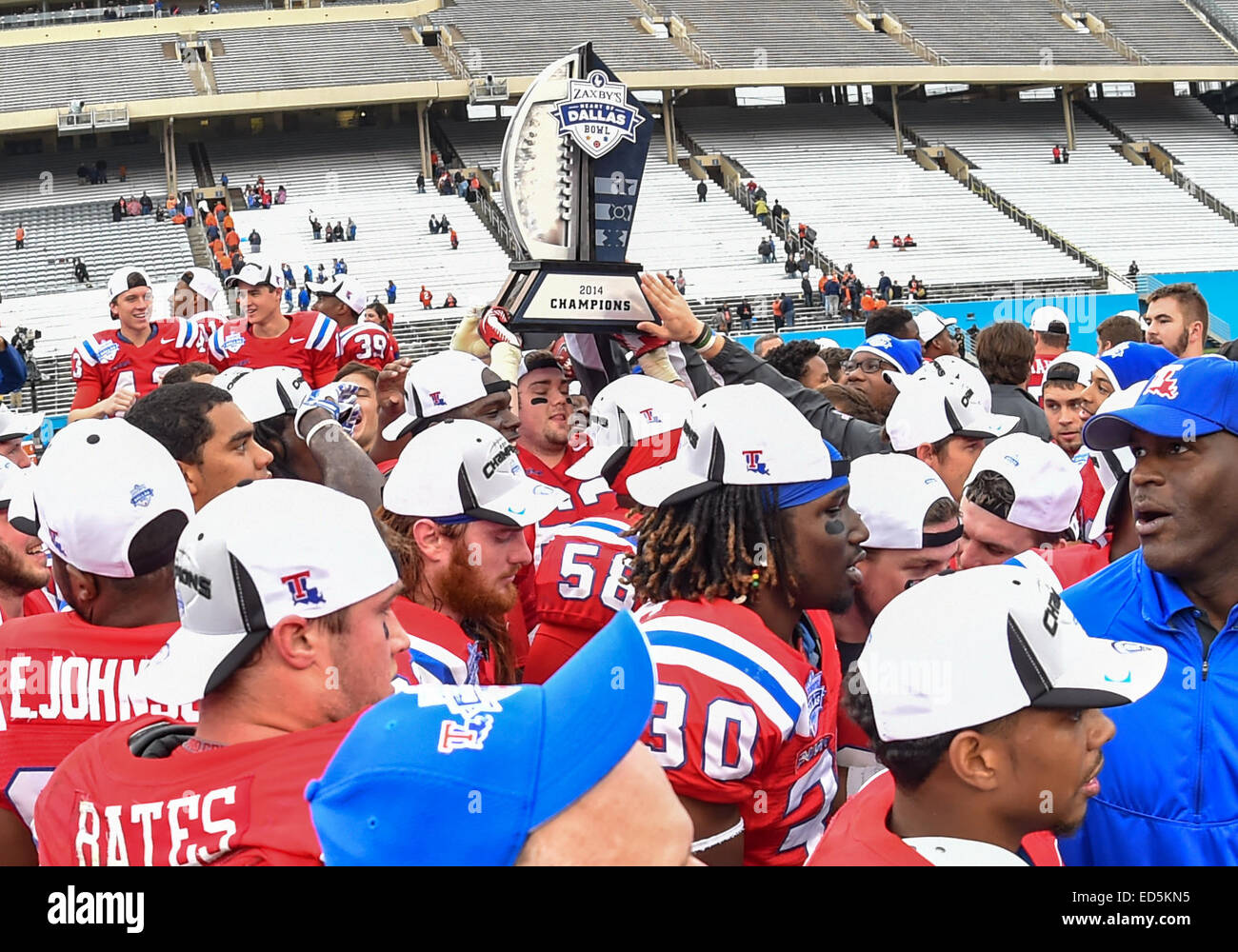 Louisiana Tech players celebrate with the trophy after the Zaxby's ...