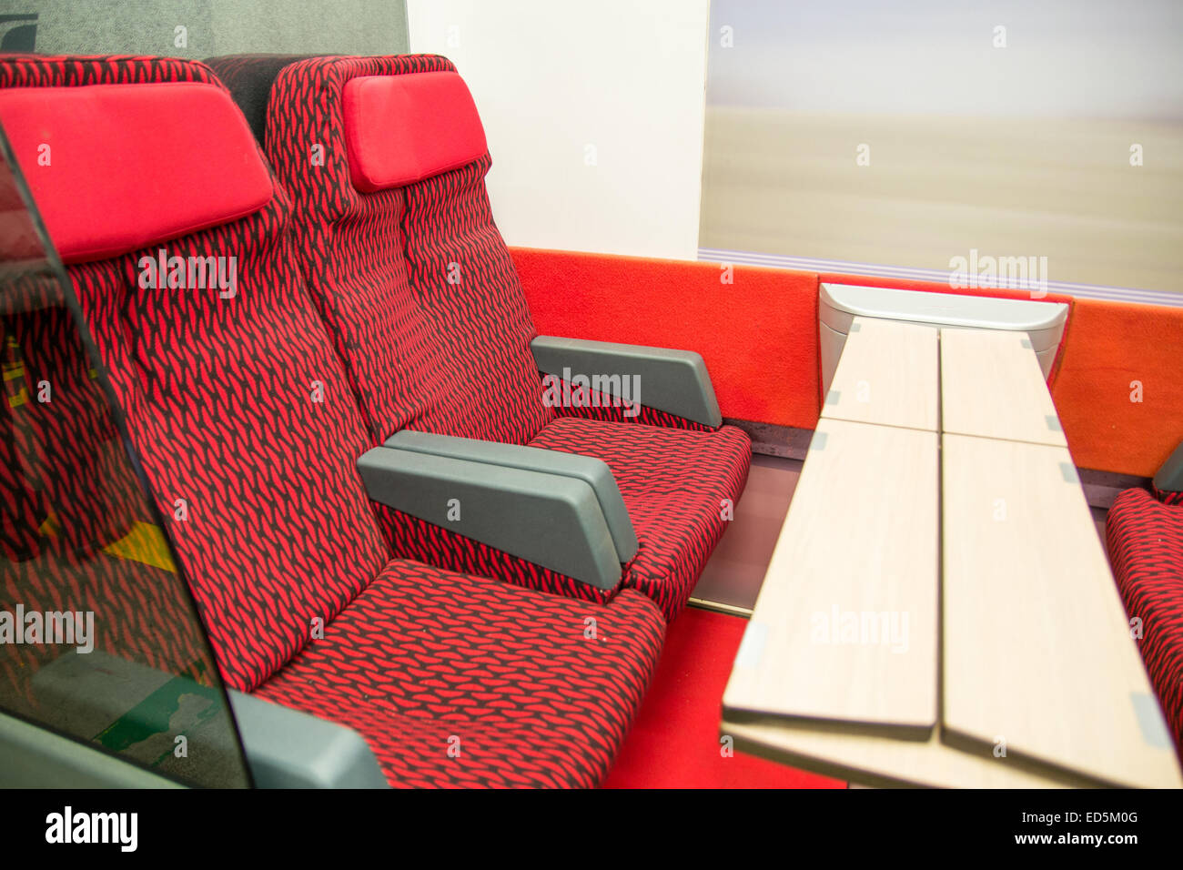 red modern seats of a railroad car Stock Photo - Alamy