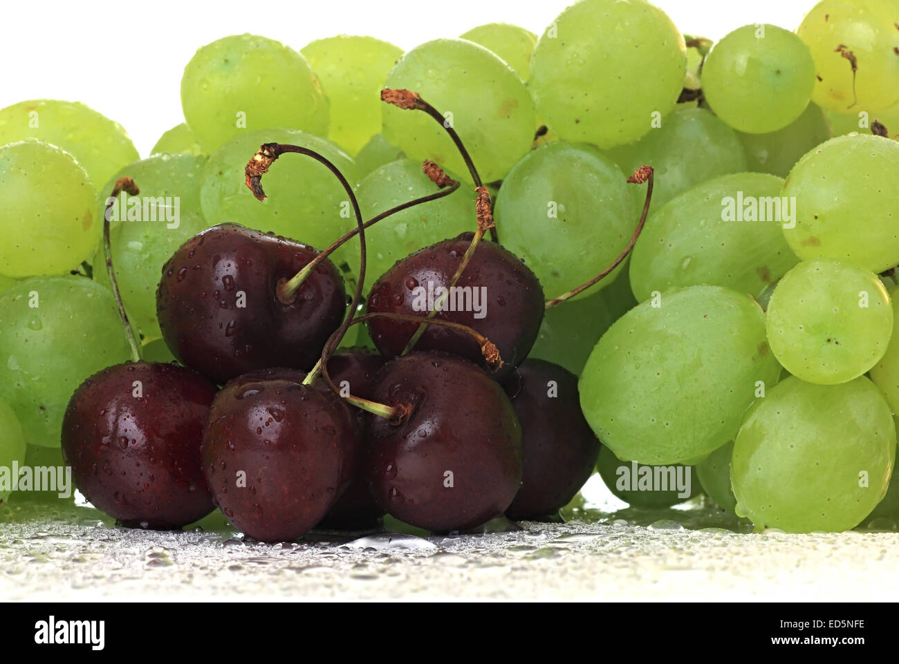 Cherry and green vine Stock Photo - Alamy