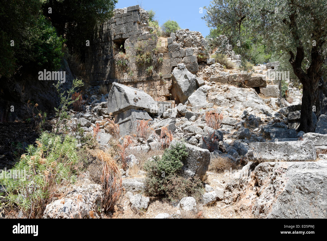 Sarcophagus amongst ruins and rubble of the ancient Lycian city. Pinara ...