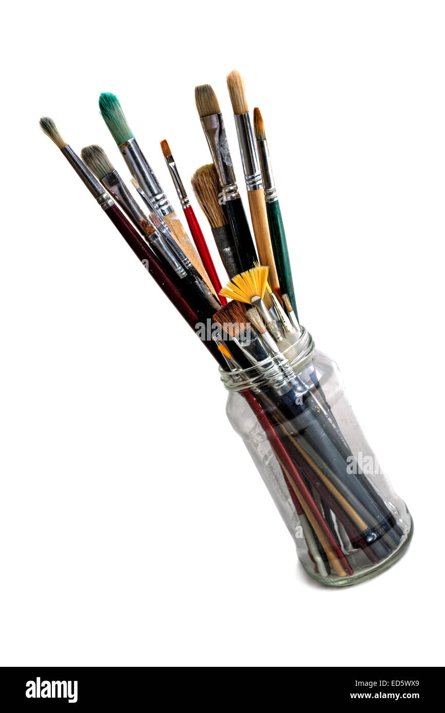 Artists paint brushes in a clear glass jar Stock Photo - Alamy