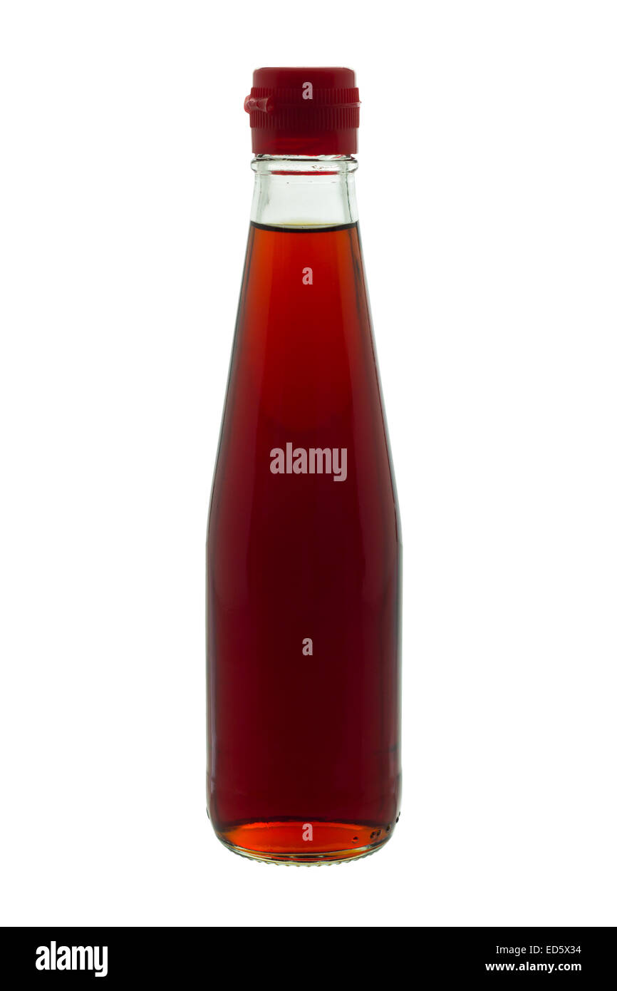 Fish sauce in glass bottle with red lid, isolated on white background ...