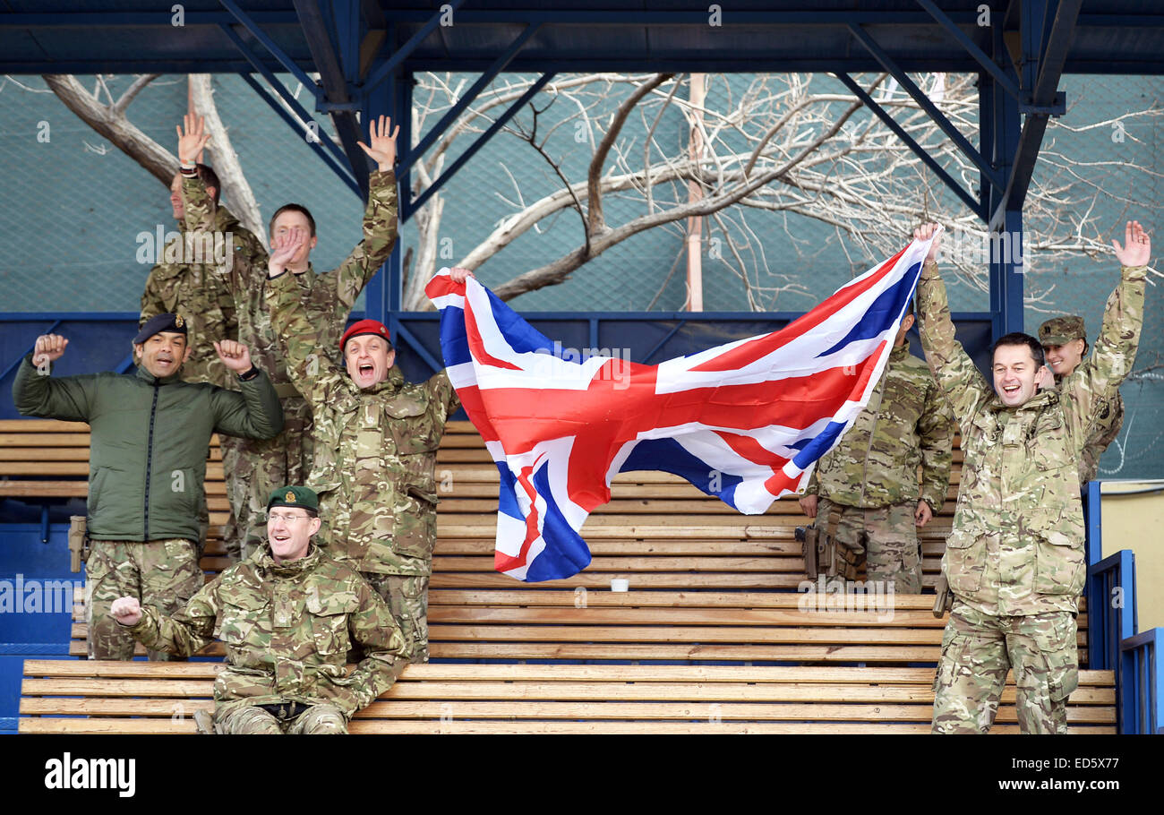 Kabul, Afghanistan. 24th Dec, 2014. British soldiers cheer after the 3 ...