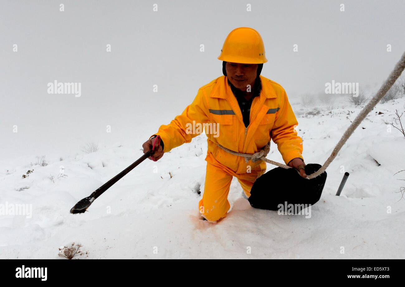 Garz, Sichuan, China. 28th Dec, 2014. A sanitation worker is cleaning ...