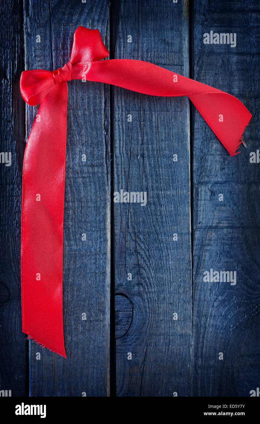 red ribbon on wooden background, festive background Stock Photo - Alamy