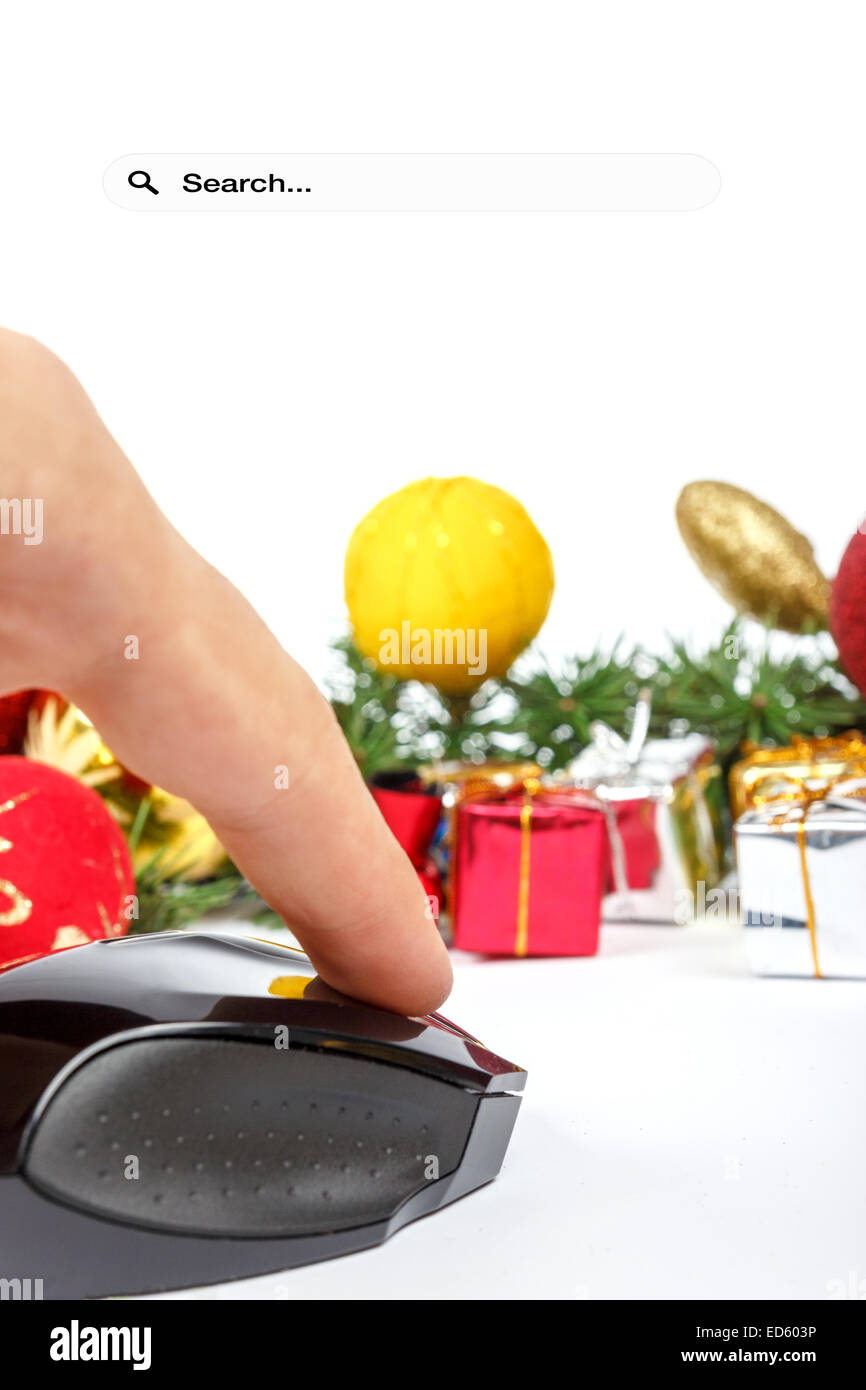 Hand with computer mouse and New year gifts , Online shopping searching ...