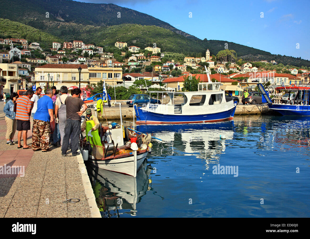 A fisherman has just arrived at the port of Vathy, Ithaca island ...