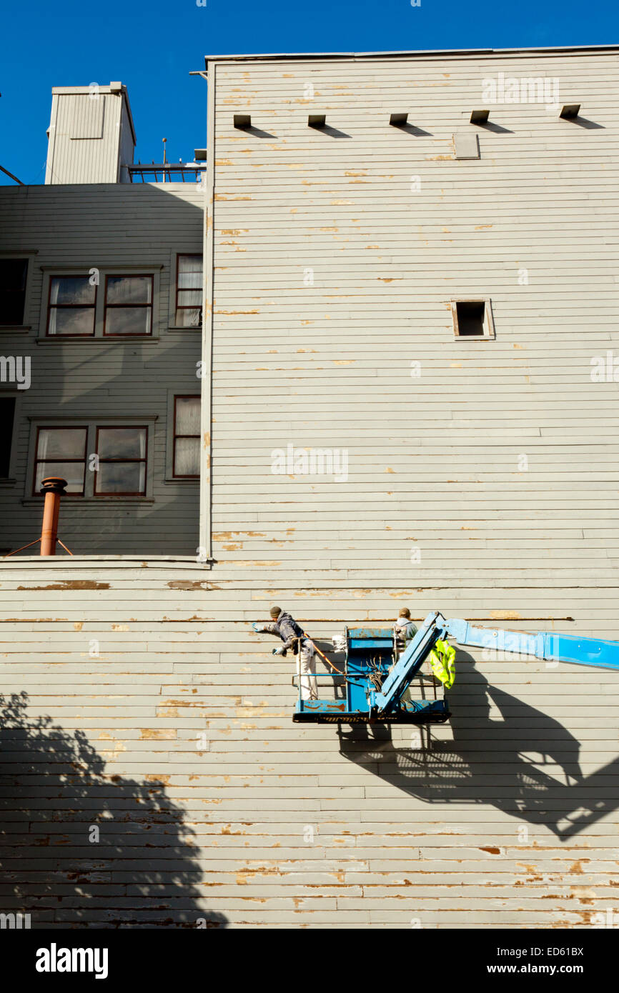 Workmen repainting the side of a building in Eureka City Humboldt ...