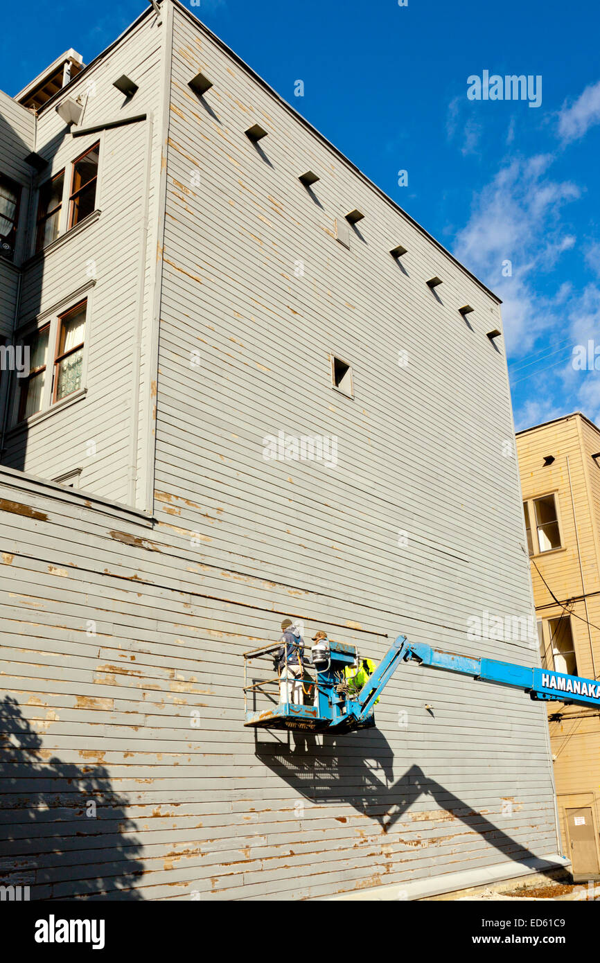 Workmen repainting the side of a building in Eureka City Humboldt ...