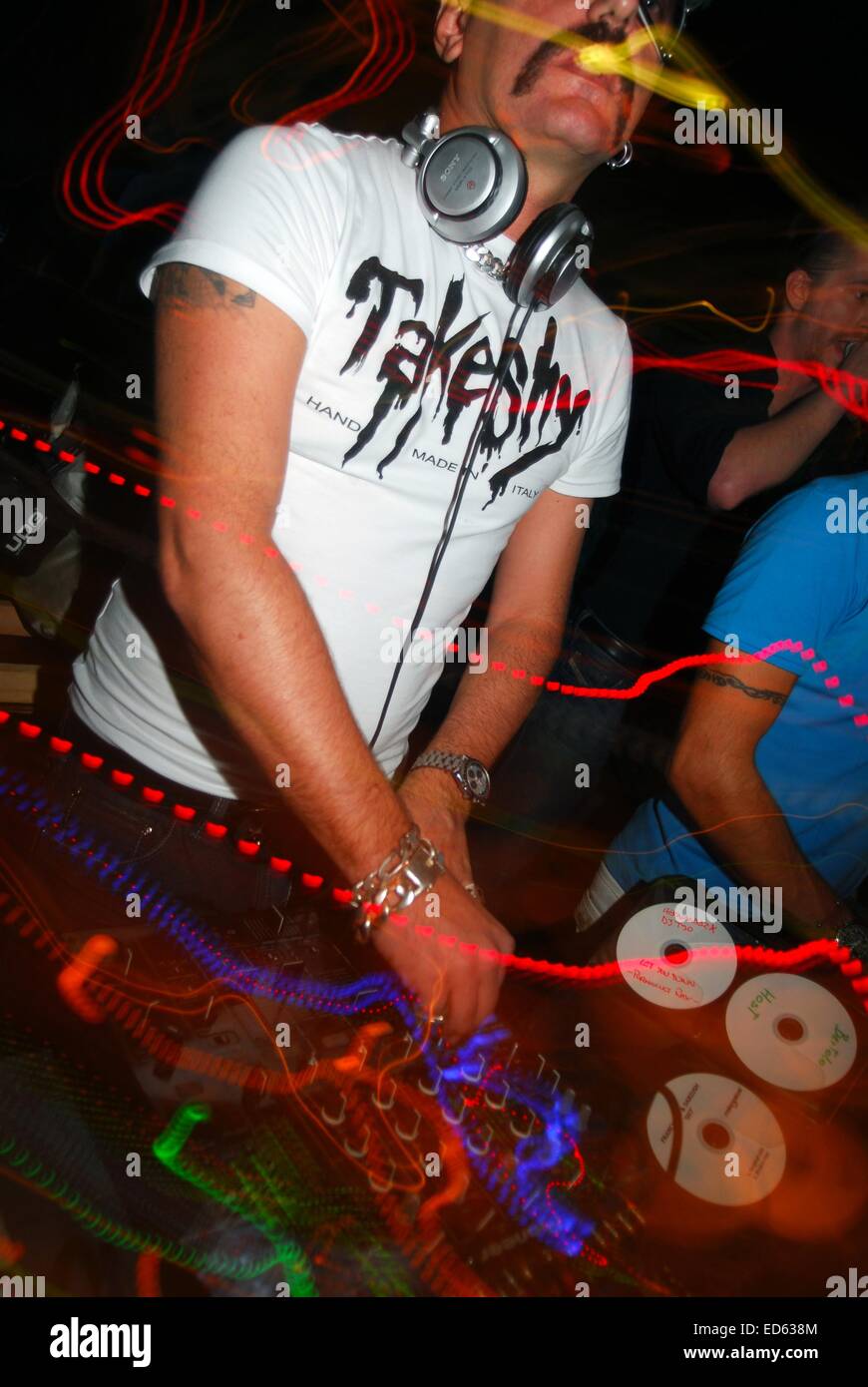 Disk jockey play music in DJ console at party Stock Photo - Alamy